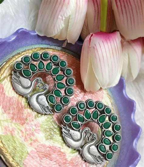 Peacock Stud Revolusis Instore