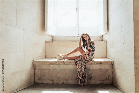 Beautiful Asian Filipino Female In Her 20s Posing While Sitting Down