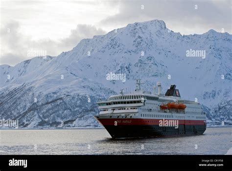 Hurtigruten Cruise Ship Ms Kong Harald In Front Of A Wintery Fjord