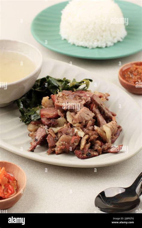 Beef Sei Sapi Indonesia Traditional Smoked Beef Served With Boiled Cassava Leaves And Sambal