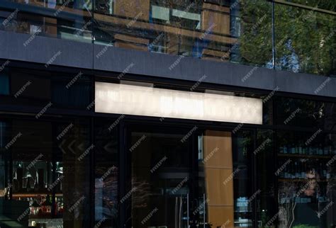Premium Photo Horizontal Illuminated Poster On Glass Facade