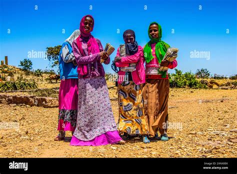 Colourfully Dressed Schoolgirls At Their Way Home At The Pre Aksumite Settlement Of Qohaito