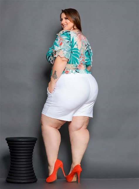 A Woman In High Heels Is Posing For The Camera