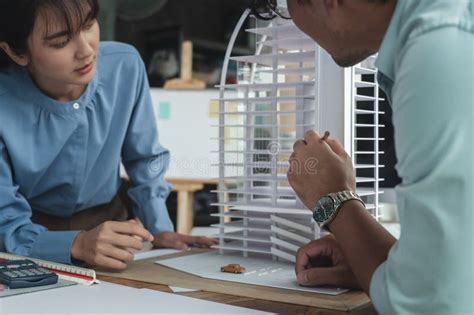 Engineer And Architects Women Discussing To Concept Of Building Design Estimation For