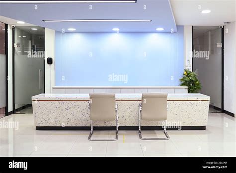 Front View Of A Modern Minimalist Reception Desk In The Empty Stylish