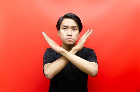 Premium Photo Asian Doing Prohibition Crossing Hand Gesture With Anger