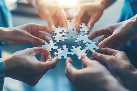 teamwork collaboration hands holding puzzle pieces in circular formation unity and problem