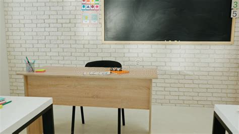 Empty Elementary School Classroom With Desks Chairs And Chalkboard At Daylight Workspace For