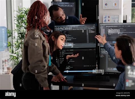 software programmers analyzing html code and database brainstorming script ideas to develop new