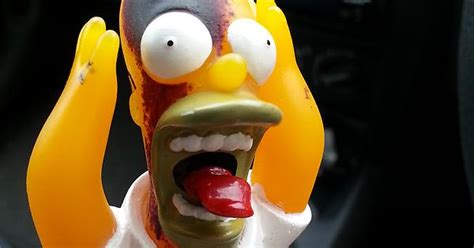 Left My Homer Figure On My Dashboard On A Hot Day Looks Like Hes Been In Some Horrific