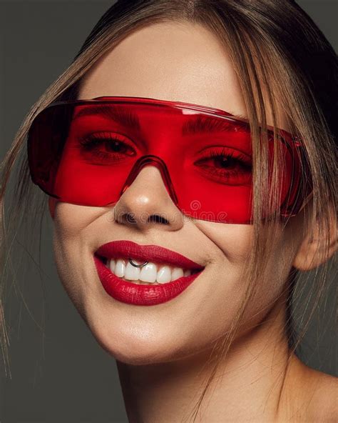 Close Up Portrait Of Beautiful Young Woman In Trendy Glasses Smiling