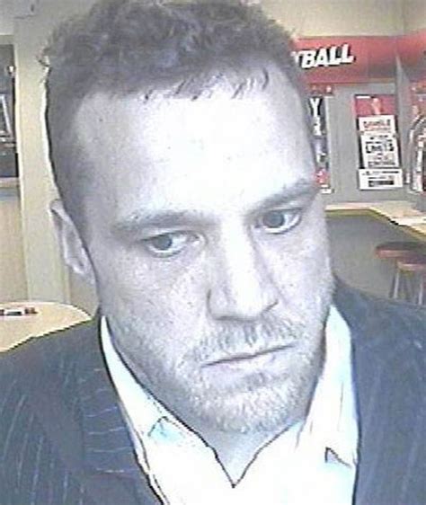 Cctv Footage Shows Man In Suit Robbing A Ladbrokes Store Armed With A Claw Hammer Uk News