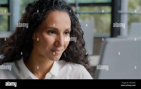 Focused Serious Woman Working On Computer In Office Looking At Monitor
