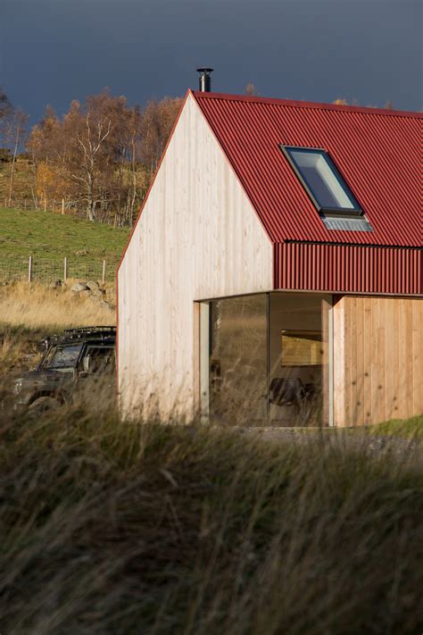 Moxon Adds Red Metal And Larch Extension To Scottish Highlands Farmhouse