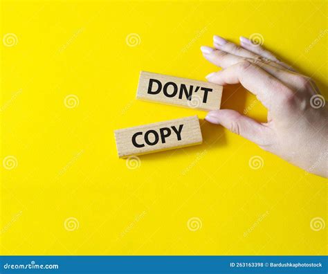 Dont Copy Symbol Wooden Blocks With Words Dont Copy Beautiful Yellow Background Businessman