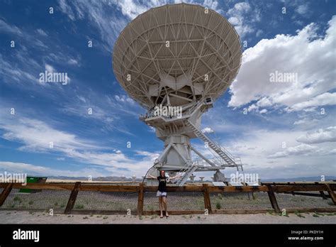 Beautiful Woman Poses To Show Scale Of The Very Large Array Located In Beautiful Woman Poses To Show Scale Of The Very Large Array Located In
