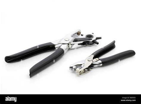 Hole And Rivet Tool On White Stock Photo Alamy