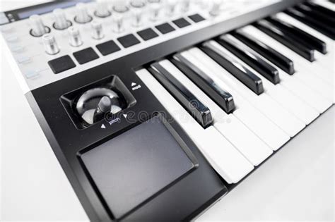 Close Up Of A Digital MIDI Keyboard Controller Featuring White Keys And Pitch Modulation