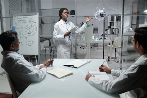 Scientist Presenting Research Findings In Lab Environment Stock Image