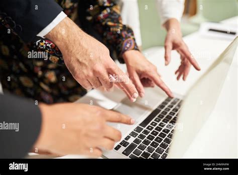 Hands And Fingers Pointing At Computer Keyboard Symbolizing Digital Internet Communication Stock