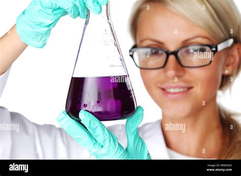 Woman Conducting A Chemical Experiment Stock Photo Alamy