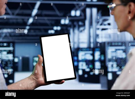 Computer Scientists Using Mock Up Tablet To Check Blade Servers Close
