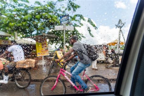 View Through A Wet Window Of A Car Of People Passing By On The Street On A Day Of Intense Rain