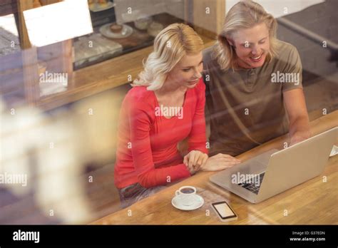 Couple Using A Laptop Stock Photo Alamy