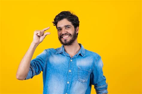 Premium Photo Man Making Small Thing Finger Signs