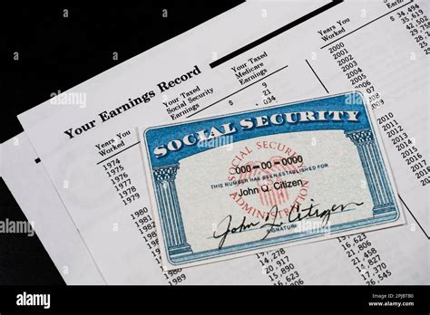 Fake Social Security Card With SSA Earnings Record On Black Background Stock Photo Alamy