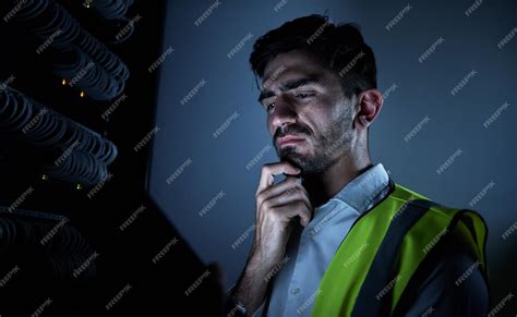 Premium Photo Engineer Man Thinking And Dark Server Room For Information Technology