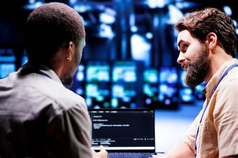 Premium Photo Coworkers Updating Blade Servers Writing Complex
