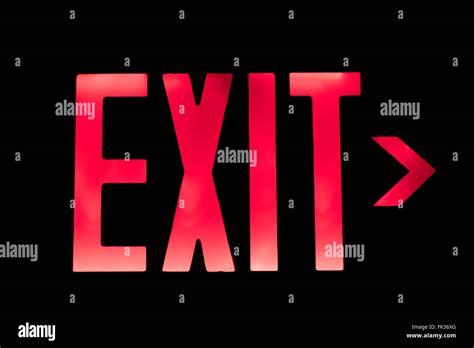 Lit Red Exit Sign Pointing To The Right Stock Photo Alamy