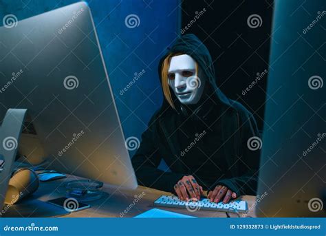 Female Hacker Sitting In The Dark With His Laptop And Tries To Crack
