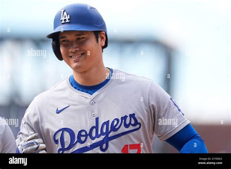 Los Angeles Dodgers Shohei Ohtani Smiles After Reaching First Base On