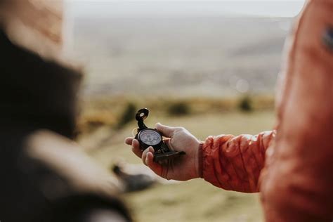 Hiker Holding Compass Hill Photo Premium Photo Rawpixel