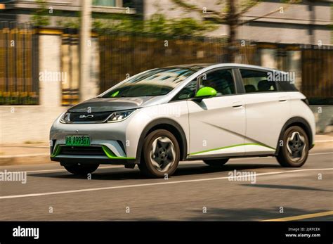 Byd Dolphin Small Electric Hatchback Car Being Driven On The Road In Putuo District Shanghai
