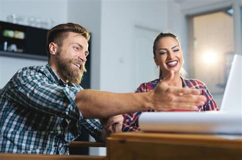 Premium Photo A Female And Male Architect Are Presenting Their Work To Their Superior