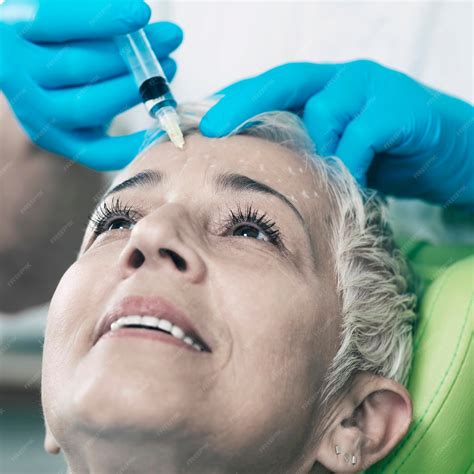 Premium Photo Woman Having Botox Injected In Her Face