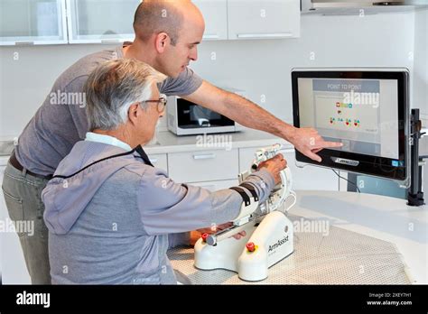 Patient With Assistive Robot For Upper Limb Rehabilitation The Robot Armassist Allows Passive