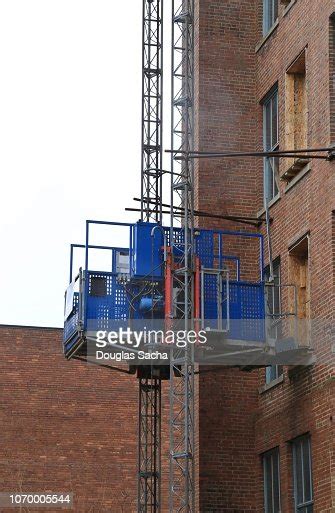 Temporary Construction Elevator Mounted On The Side Of A Building Used