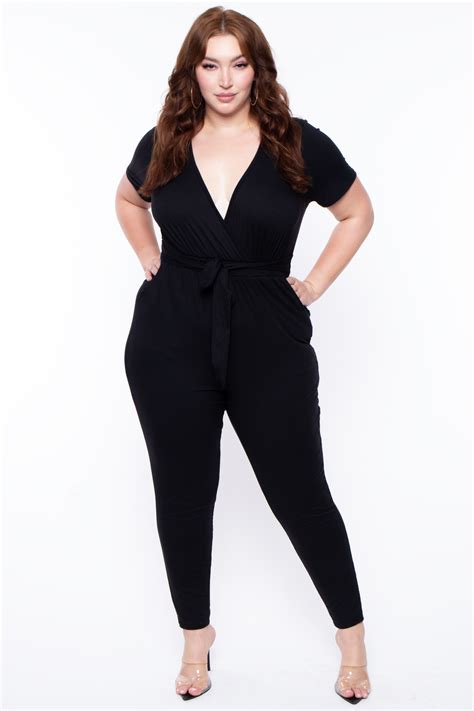 This Plus Size Stretch Knit Jumpsuit Features A V Neckline With A Cross Front Short Sleeves