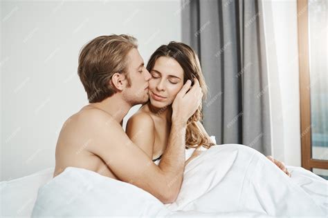 Free Photo Portrait Of Handsome Husband Gently Kissing His Attractive
