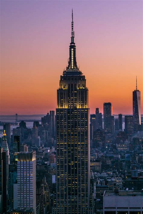 Download Empire State Building With Yellow Lights Wallpaper