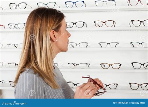 Young Woman Choosing Eyeglass Frame Stock Image Image Of Astigmatism Correction 111693531