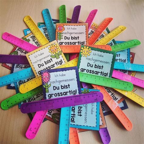 A Bunch Of Rulers That Are Sitting On Top Of A Wooden Table With Words