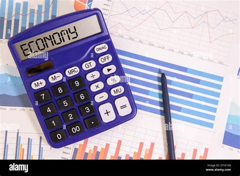 Magnifying Glass And Alarm Clock With Wooden Blocks Alphabet Letters Economy Text Message On