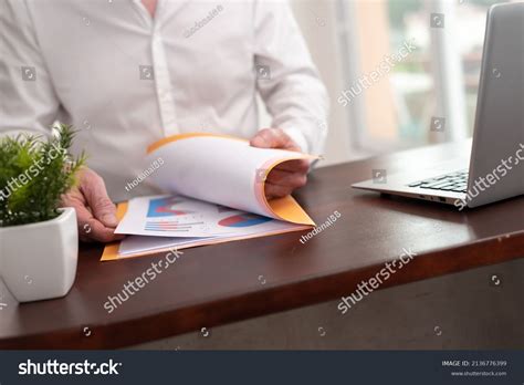 Businessman Opening Folder Paper Documents Stock Photo Shutterstock