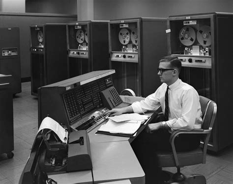 1960s Man In Shirt Tie And Thick Black Glasses Working With Ibm Data Processing System Posters