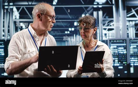Professionals Monitoring Energy Efficient Data Center Equipment Server